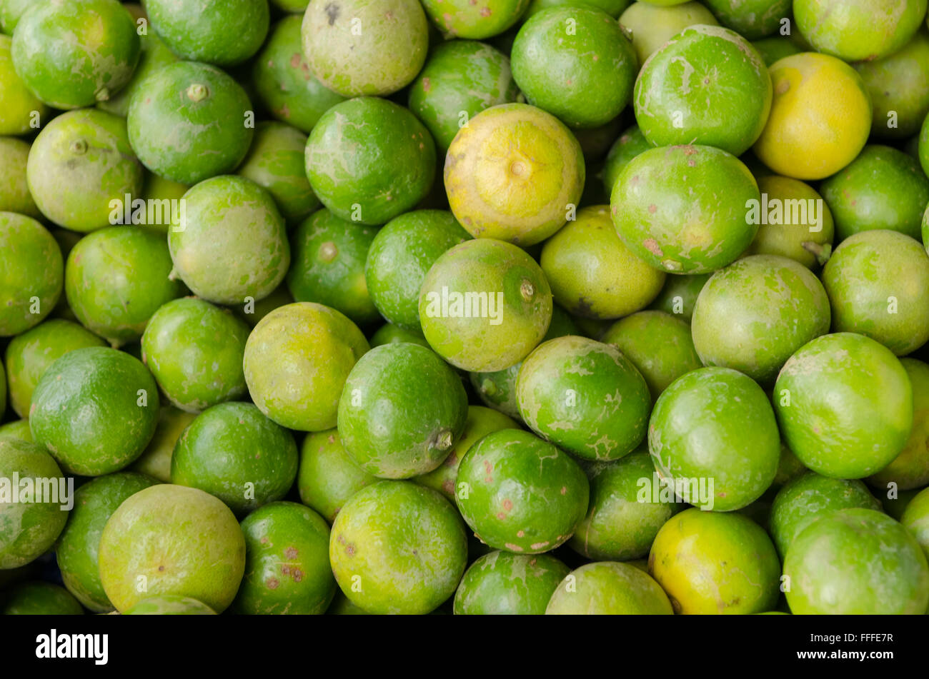 Green fresh limes sold at a market Stock Photo - Alamy