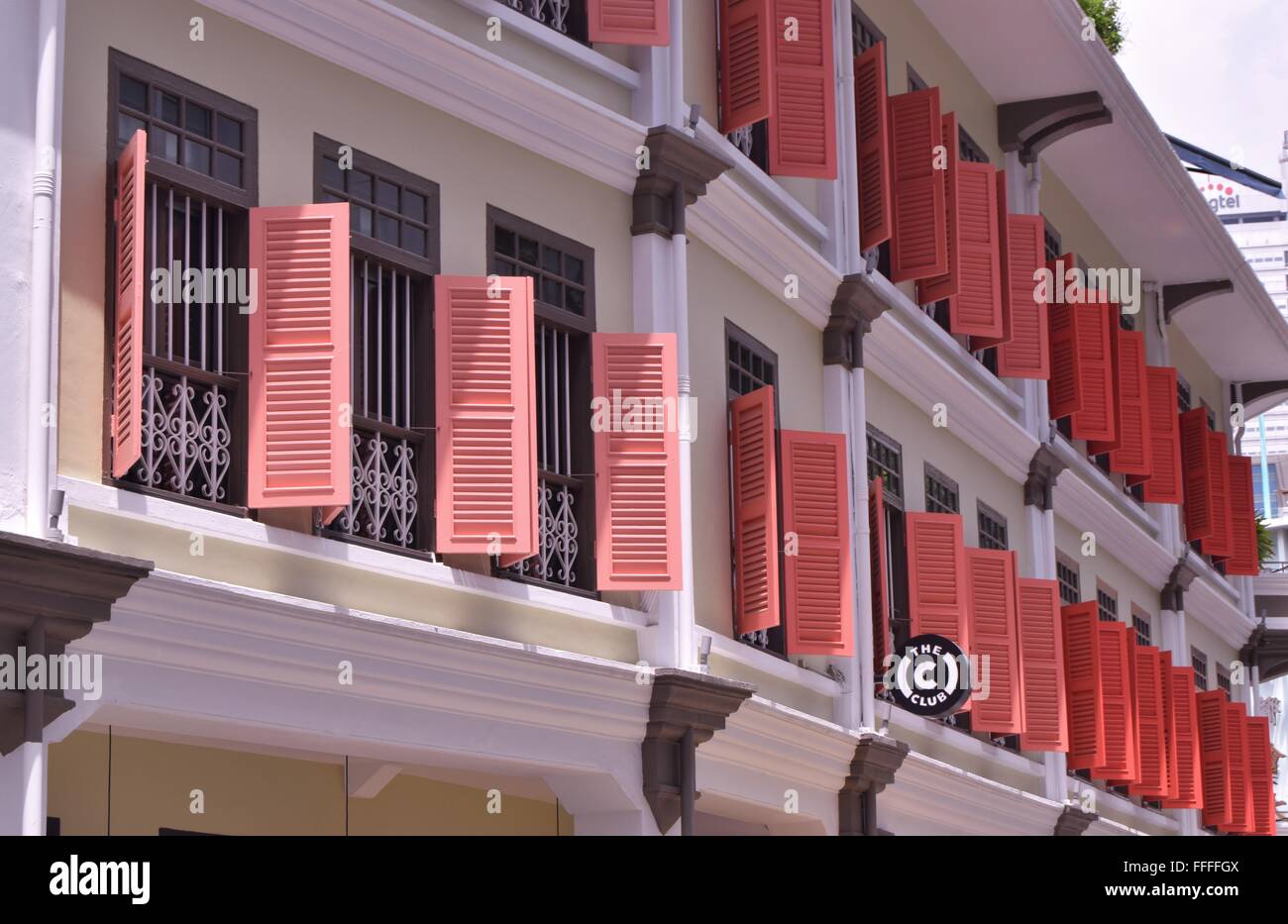 Row of colorful conservation shop houses with pink shutters in the Club ...