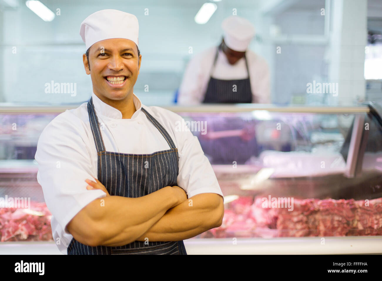 portrait of handsome mid age male butcher with arms folded Stock Photo ...
