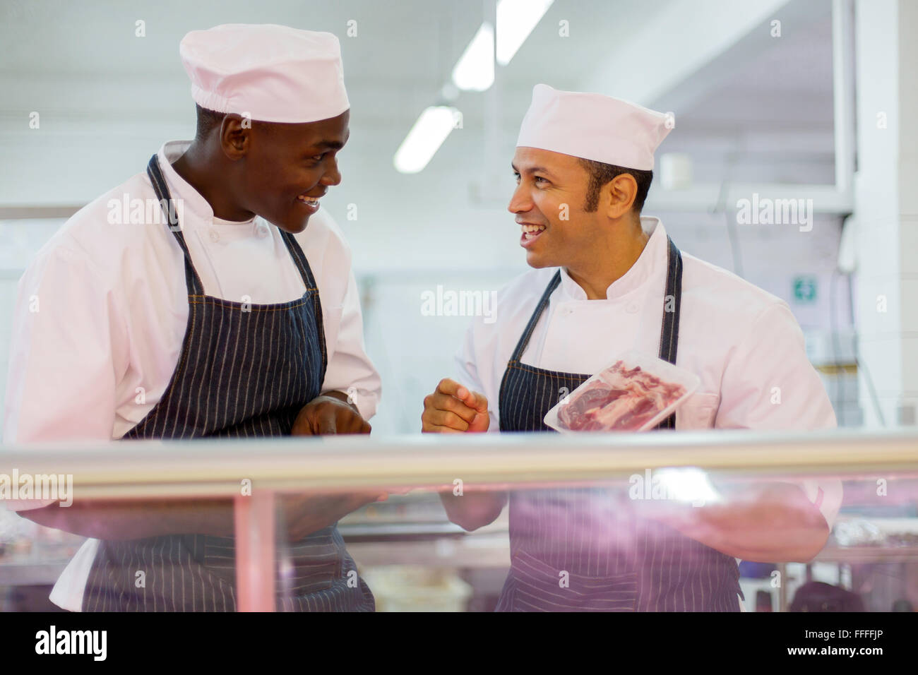 confident male butchers discussing work in butchery Stock Photo - Alamy