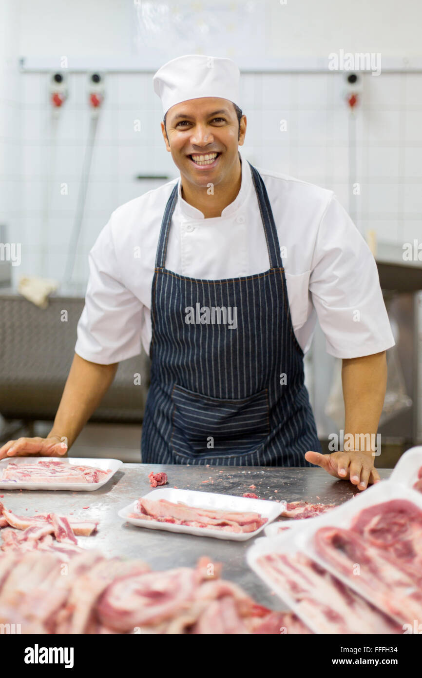 handsome middle aged man working in butcher-shop Stock Photo - Alamy