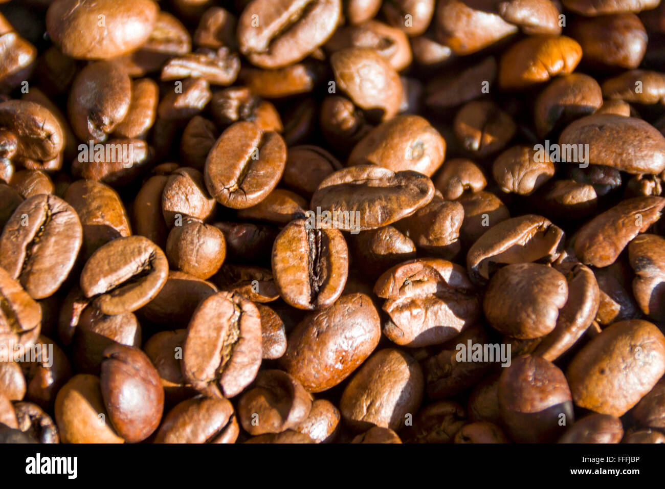 Freshly roasted coffee beans Stock Photo - Alamy