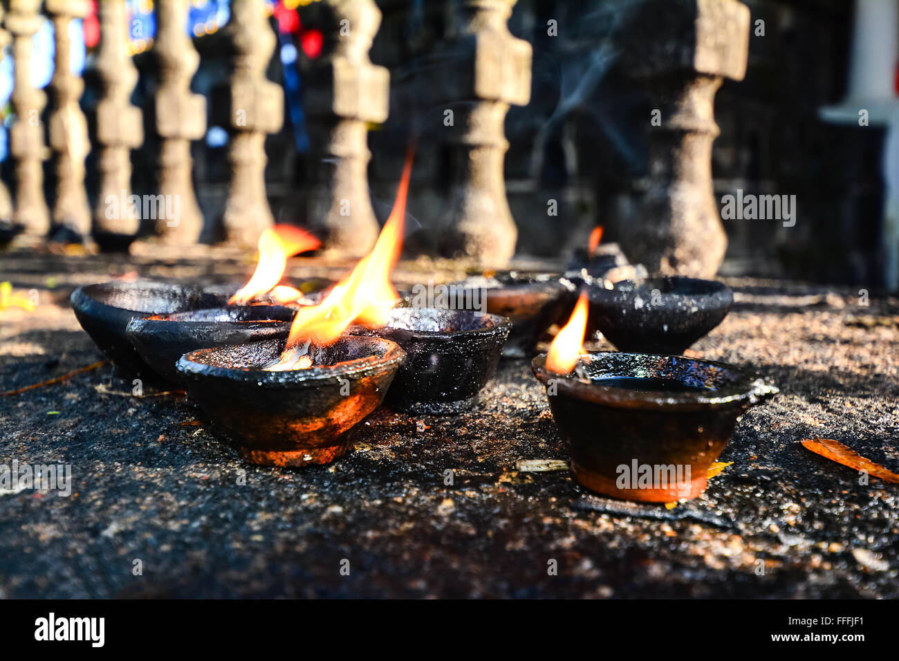 Traditional Clay Lamps Lit At The Buddhist Temple In Sri Lanka Stock ...