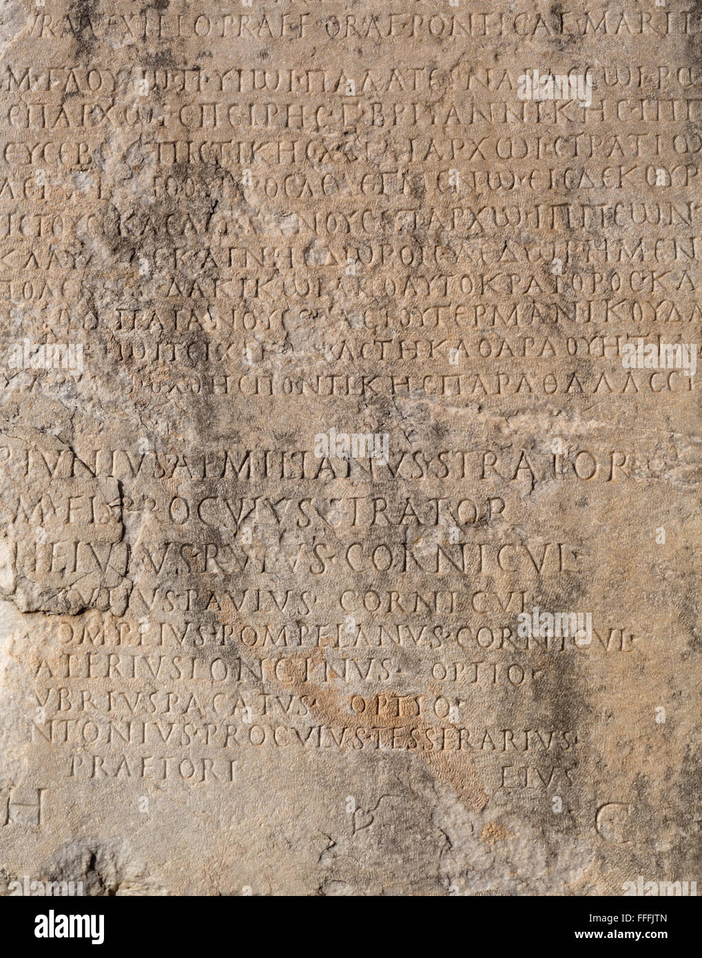 Greek inscription on stone, Temple of Hadrian, ruins of ancient Ephesus ...