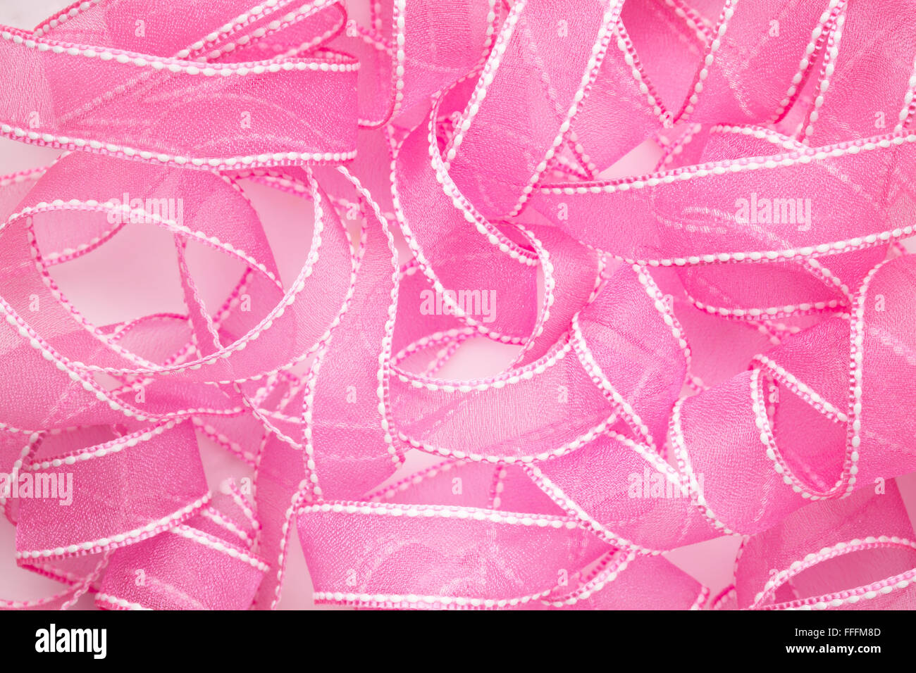 Curly pink satin,satin background Stock Photo - Alamy