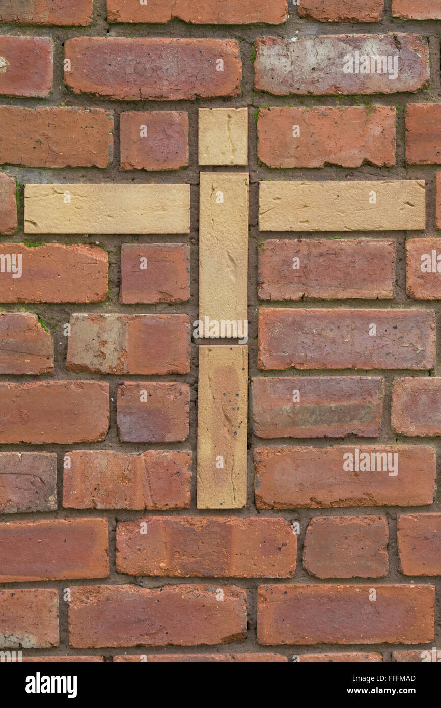 Brick cross inlaid in a red brick wall Stock Photo - Alamy