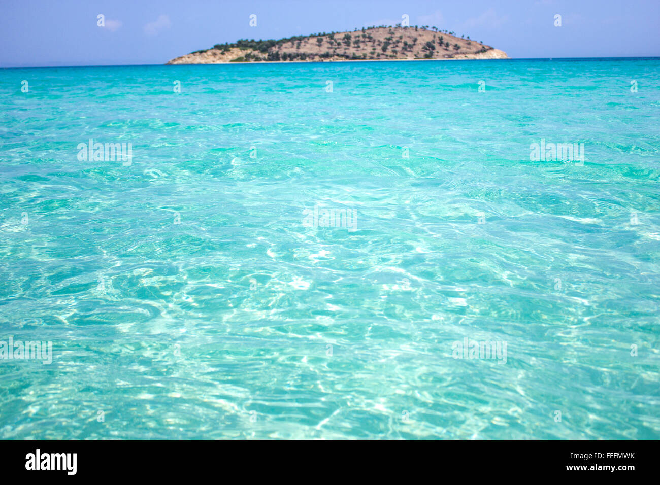 Clear sea water and small island Stock Photo - Alamy