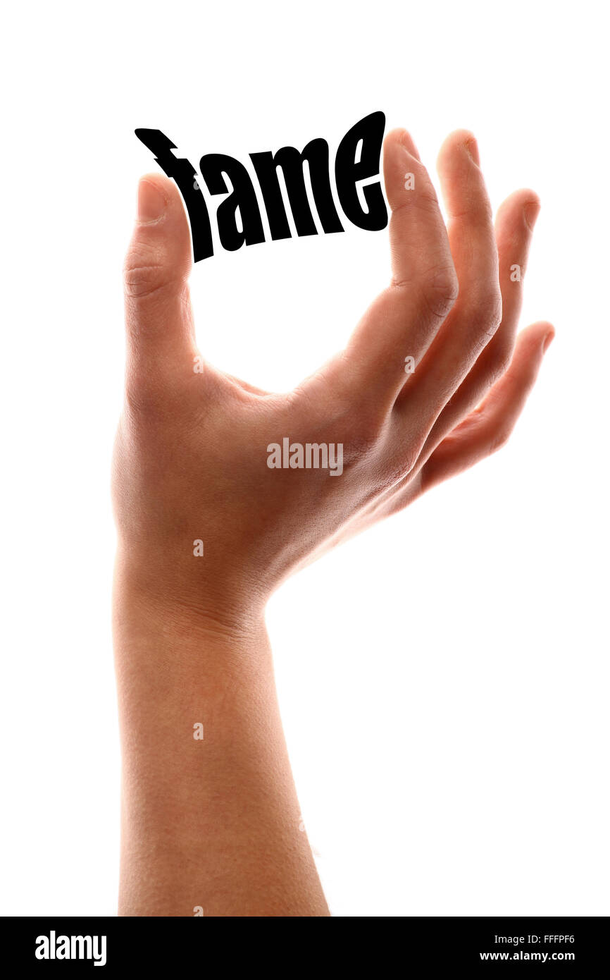 Color vertical shot of a hand squeezing the word "fame Stock Photo - Alamy