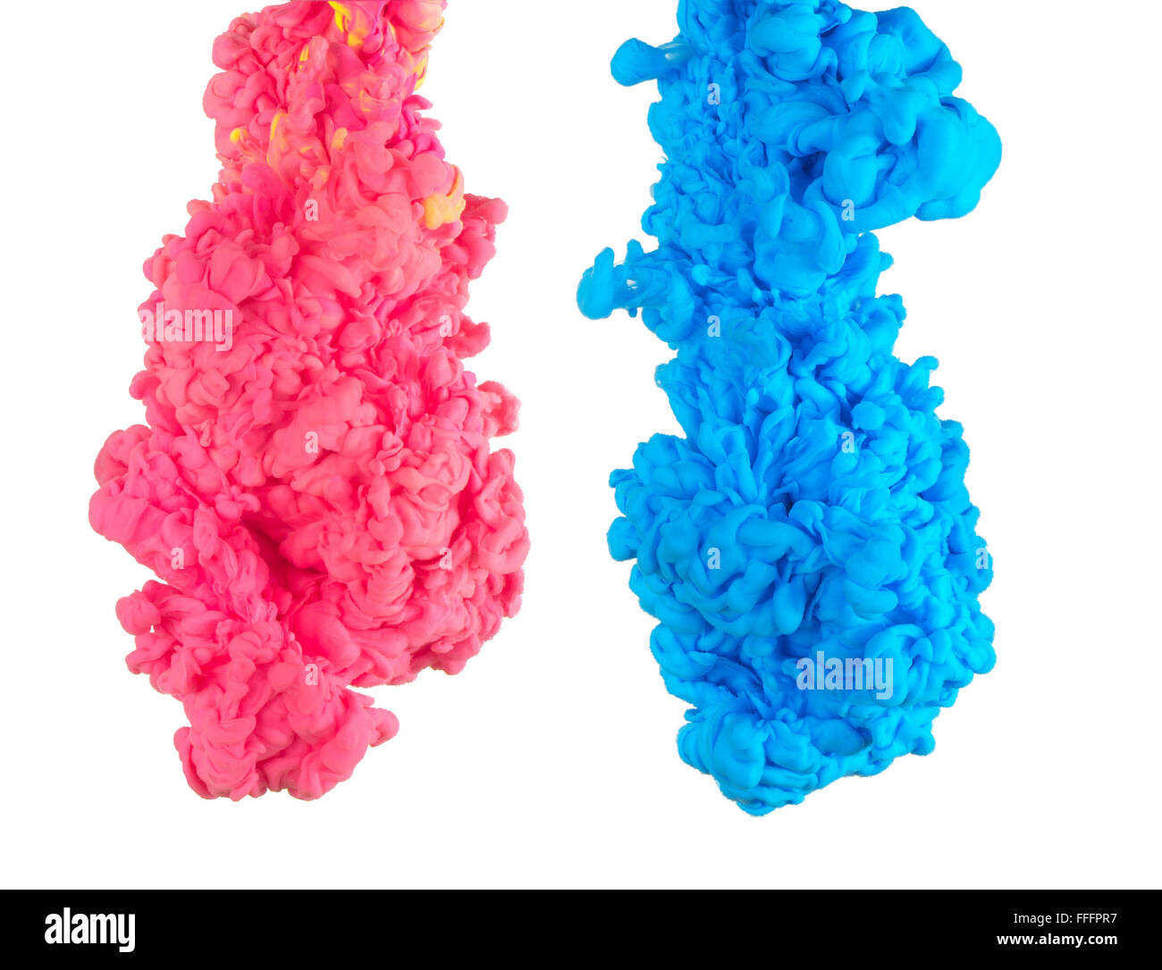 Multicolored ink drop swirling in water, creates an organic form of ...