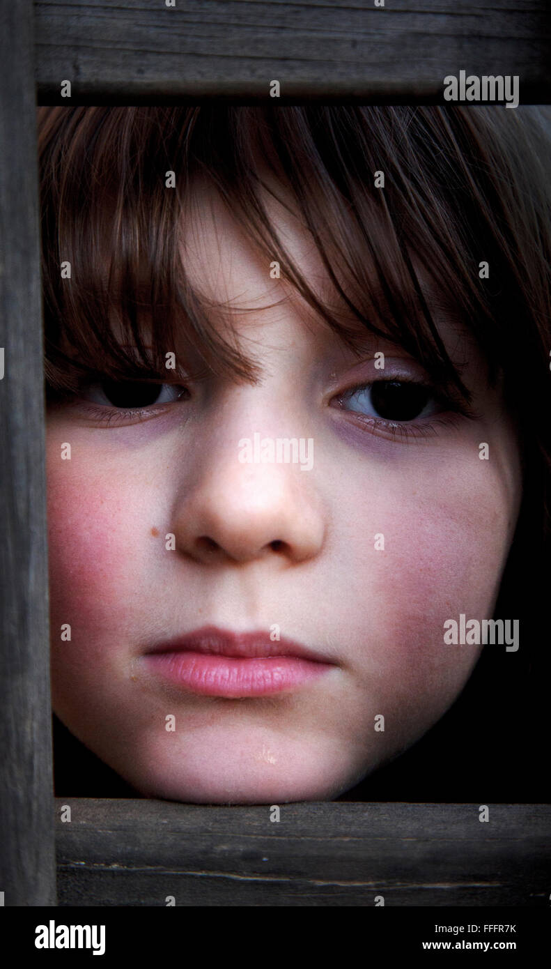 Good looking 7 year old boy in a slightly defiant mood Stock Photo - Alamy