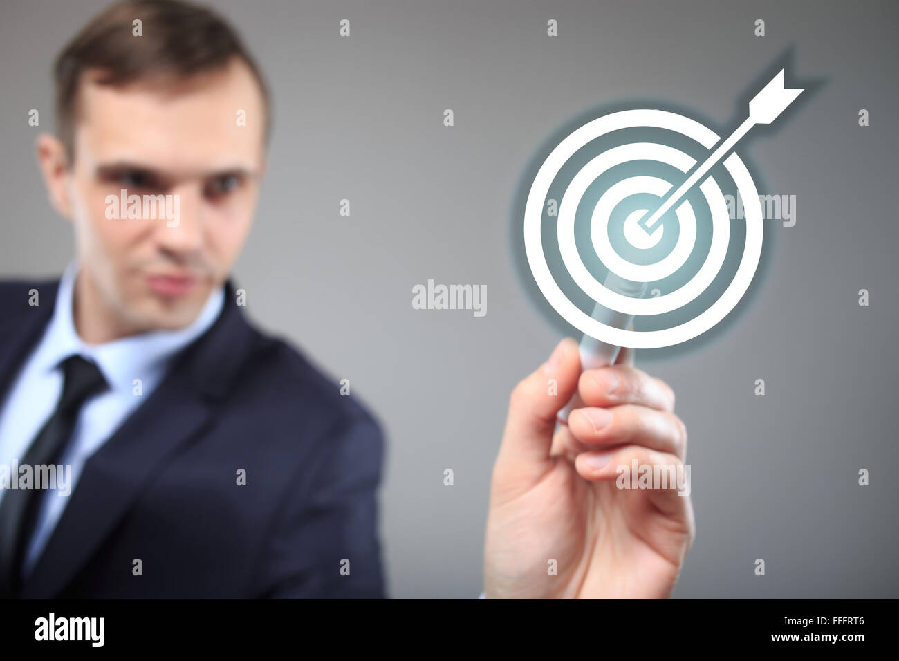 goal and trigger concepts. Businessman click on virtual target Stock ...