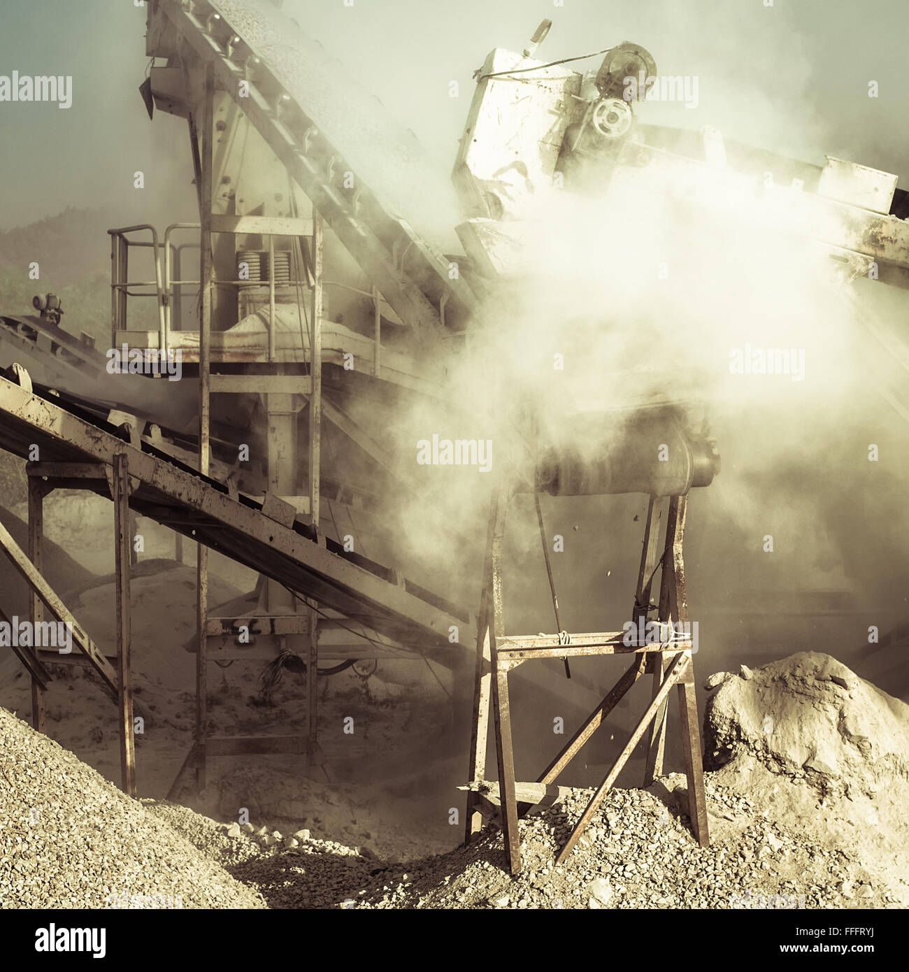 Industrial background with working gravel crusher Stock Photo - Alamy