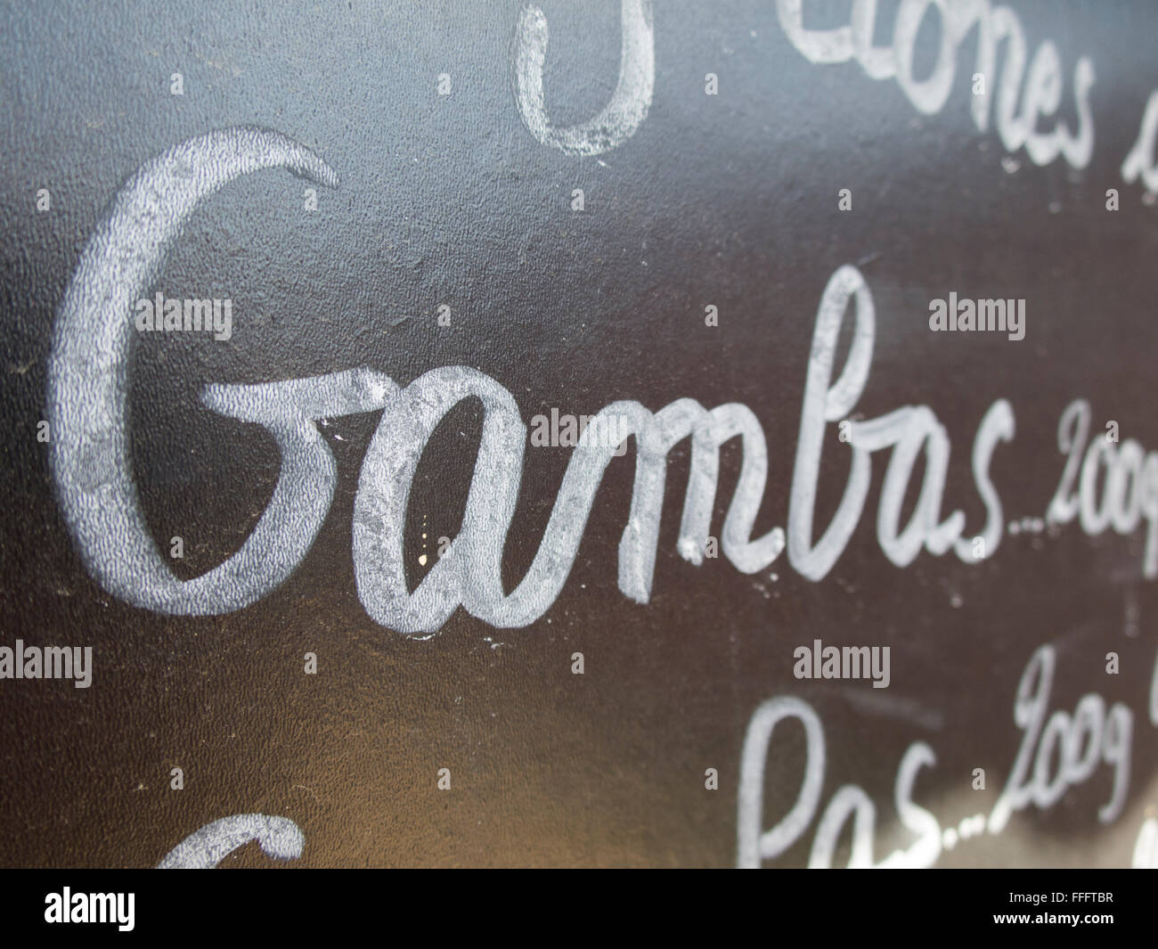 black placard spanish white handwritten in wall with typical menu food ...