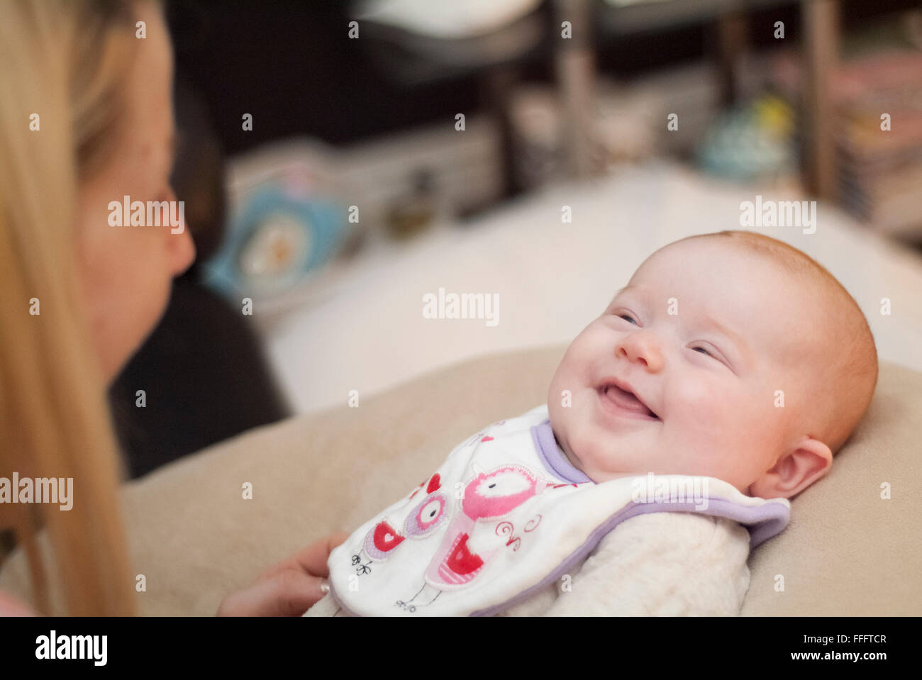 baby smiling at her mother Stock Photo - Alamy
