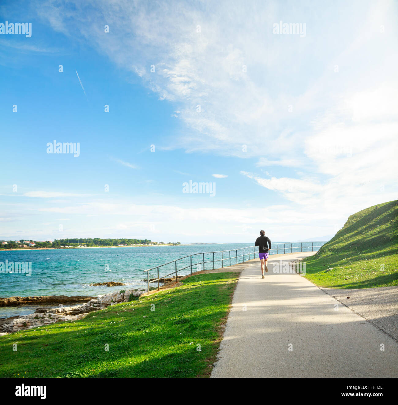 Man Running on the Sea Coast Stock Photo - Alamy