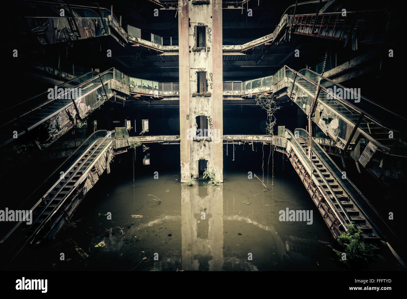 Dramatic view of damaged escalators in abandoned shopping mall sunken ...