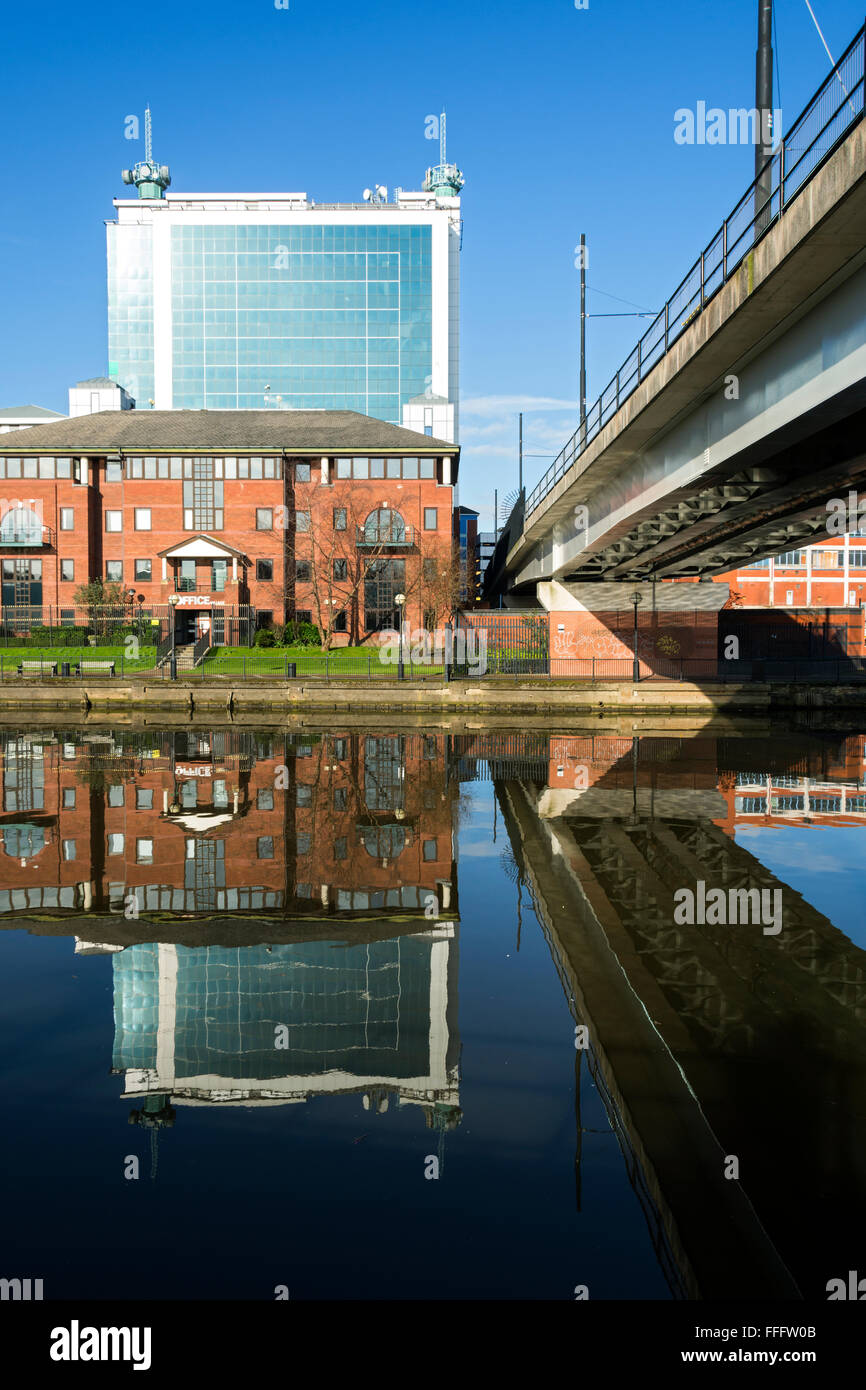 Exchange Quay buildings and the Metrolink bridge reflected in the ...