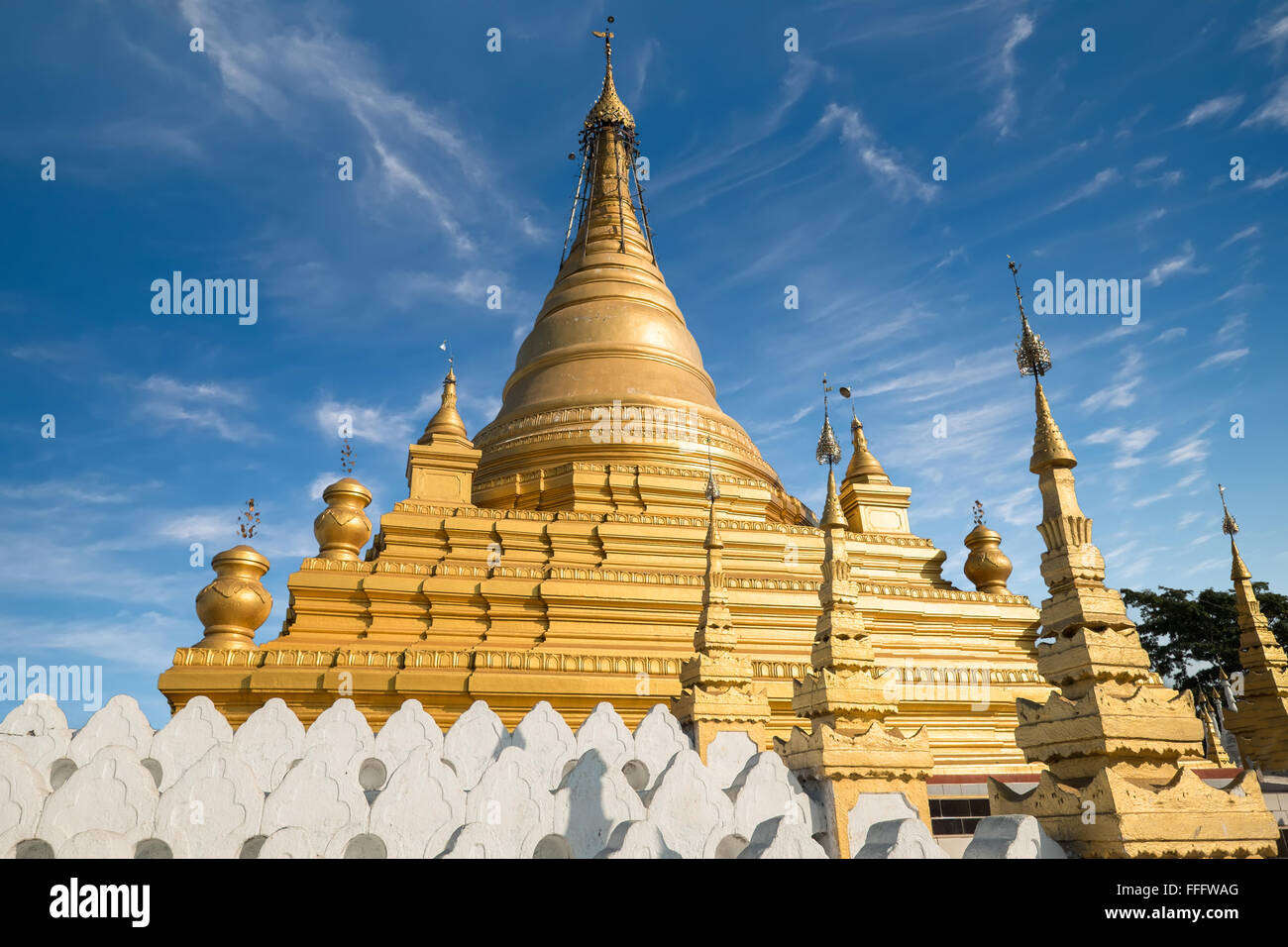 Golden Sandamuni Pagoda with row of white pagodas. Amazing architecture ...