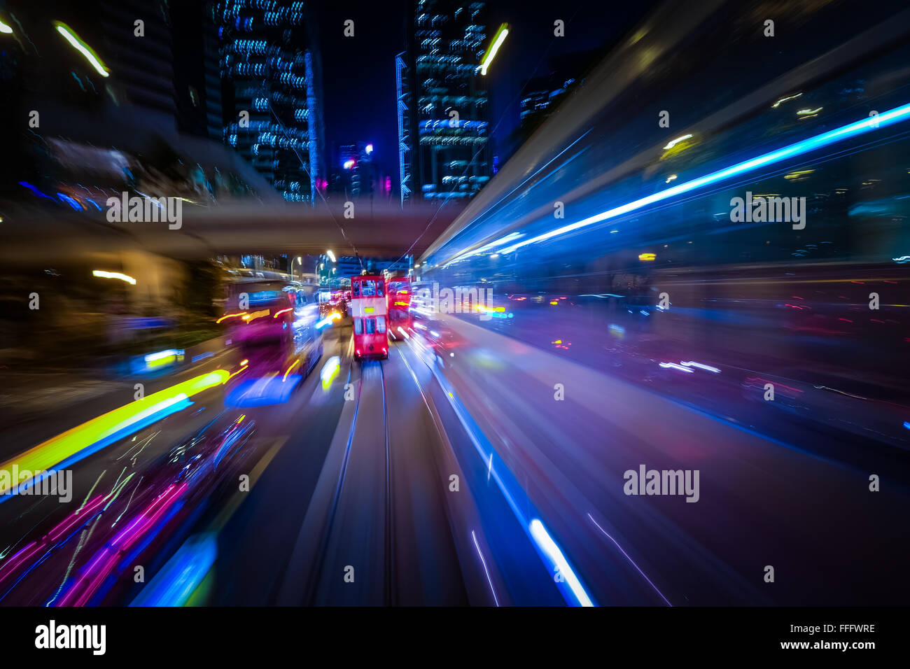 Abstract cityscape traffic background with red tram under the bridge ...