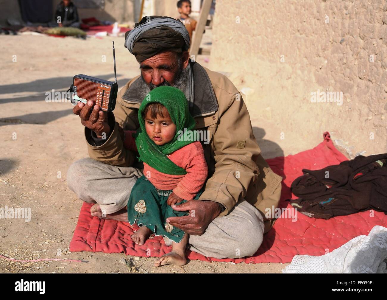 Kabul, Afghanistan. 13th Feb, 2016. An Afghan displaced man listens to ...