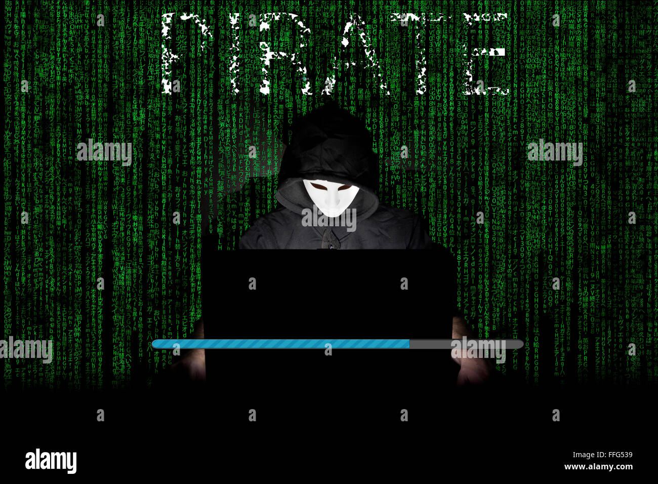 A masked man at a laptop symbolising the dangers of the Internet Stock ...