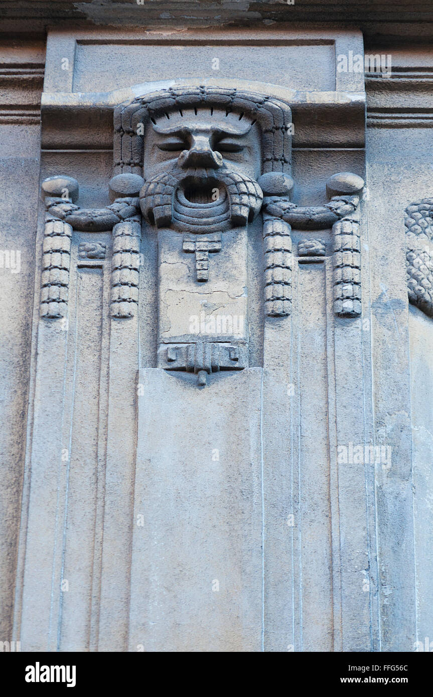 Man face on the wall. Architecture detail. Stone sculpture. Parged with ...