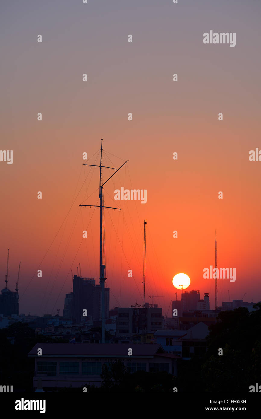 Sunset behind ship mast Stock Photo - Alamy