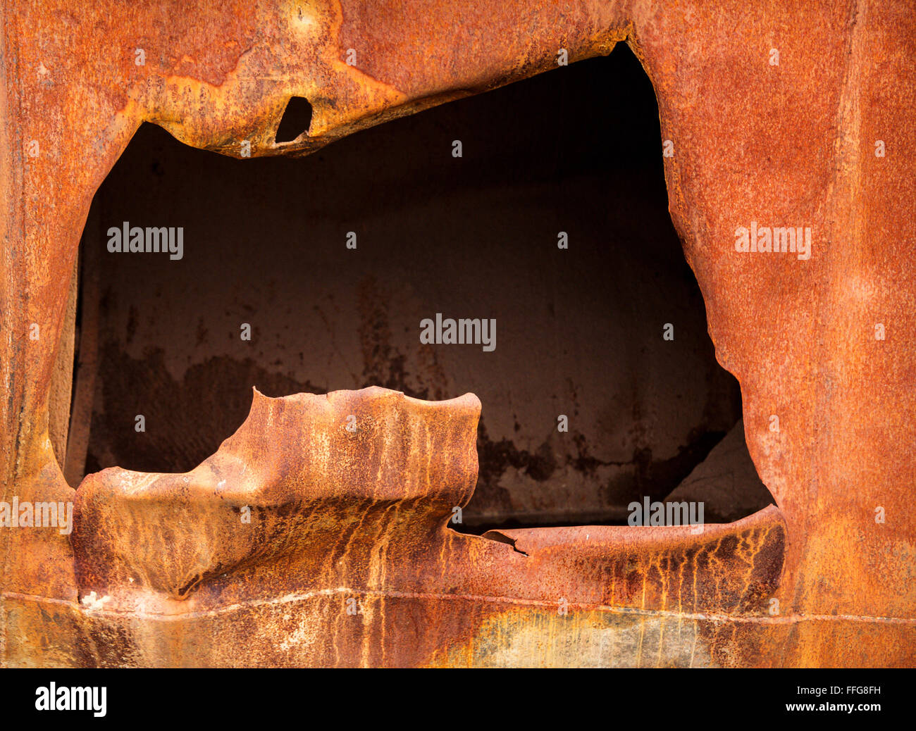 big hole in rusty steel plate Stock Photo - Alamy