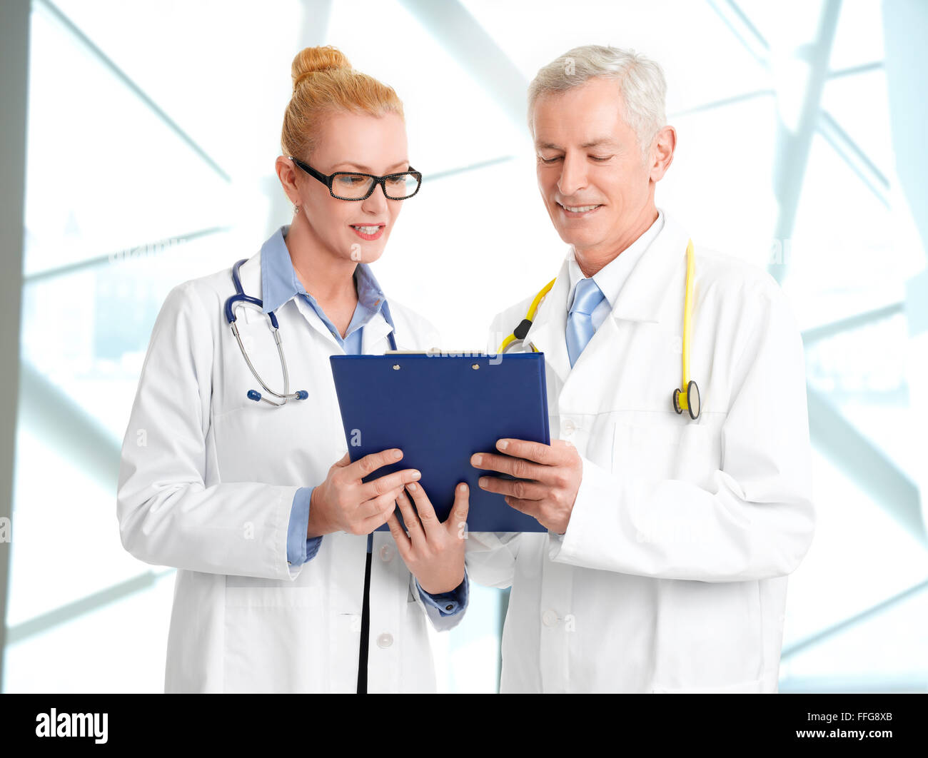 Image of medical team consulting. Portrait of female doctor holding ...