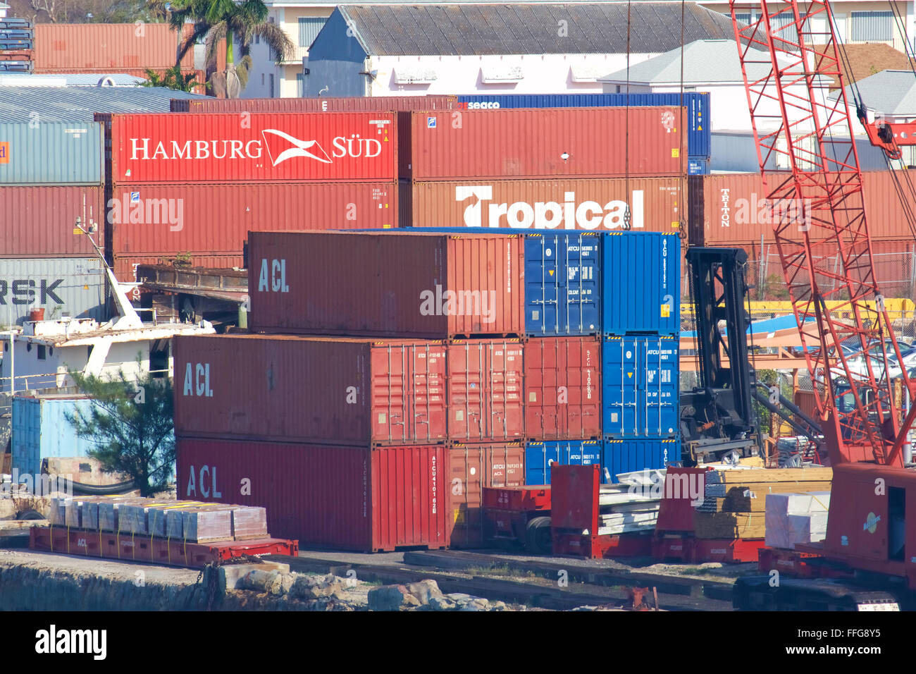 Shipping containers stacked at the Caribbean port of Nassau, Bahamas ...