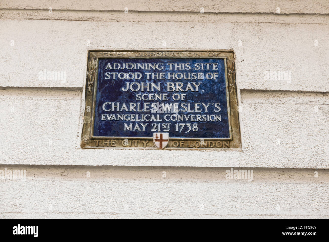 A commemorative blue plaque of John Bray house on display on a wall in ...