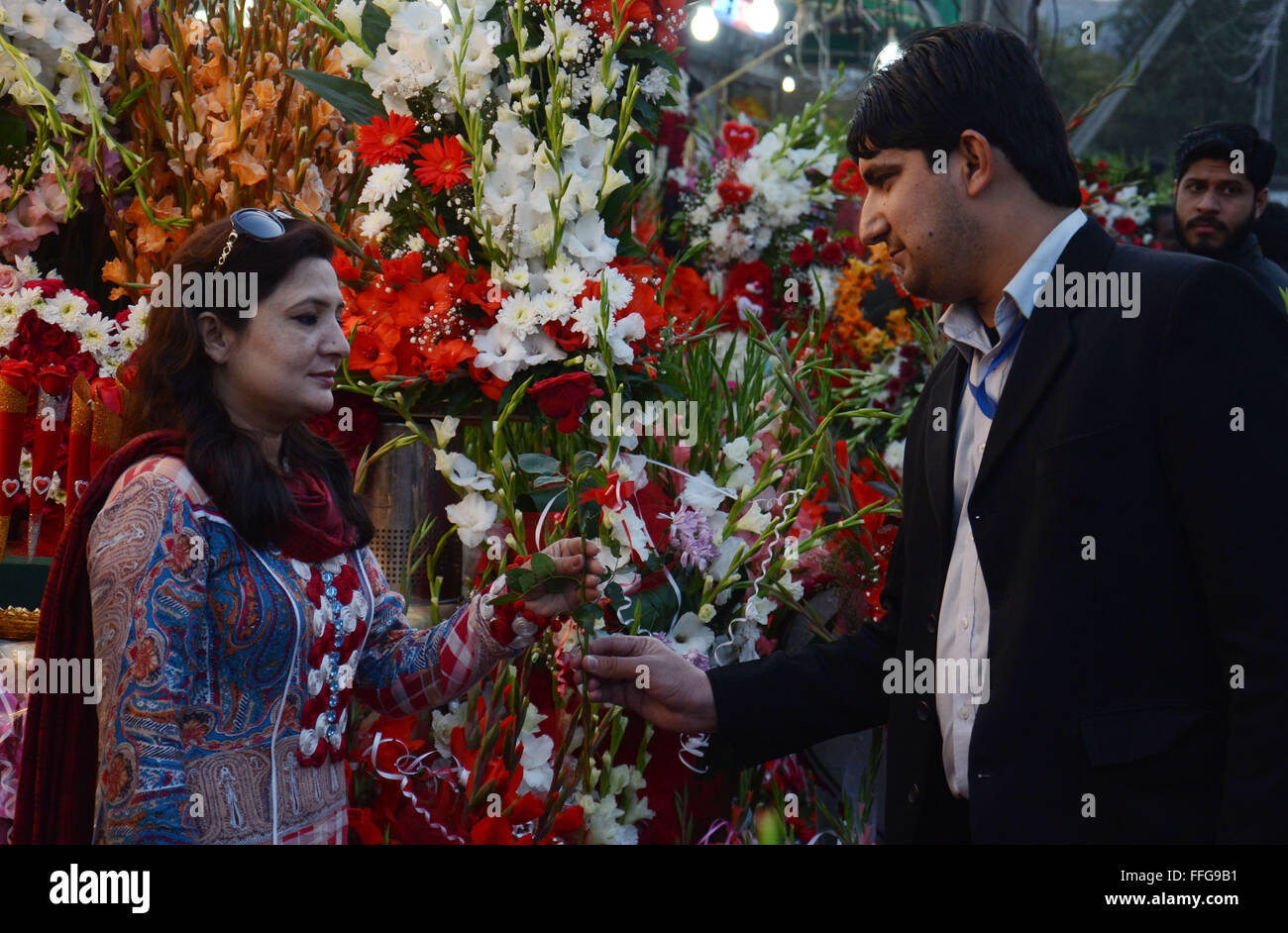Lahore, Pakistan. 13th Feb, 2016. Pakistani citizens purchasing fresh ...