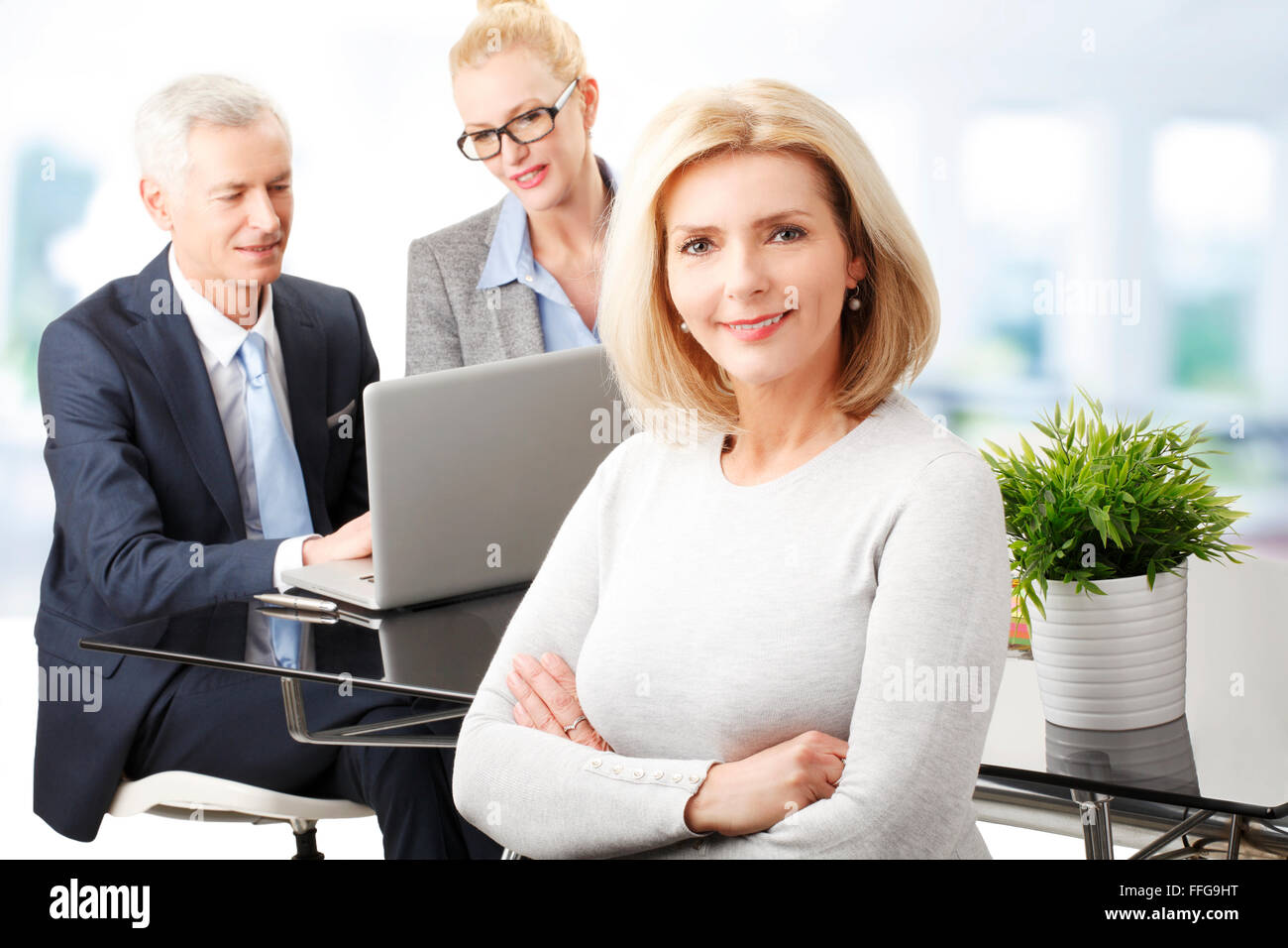 Portrait of efficiency sales woman standing at office while financial ...