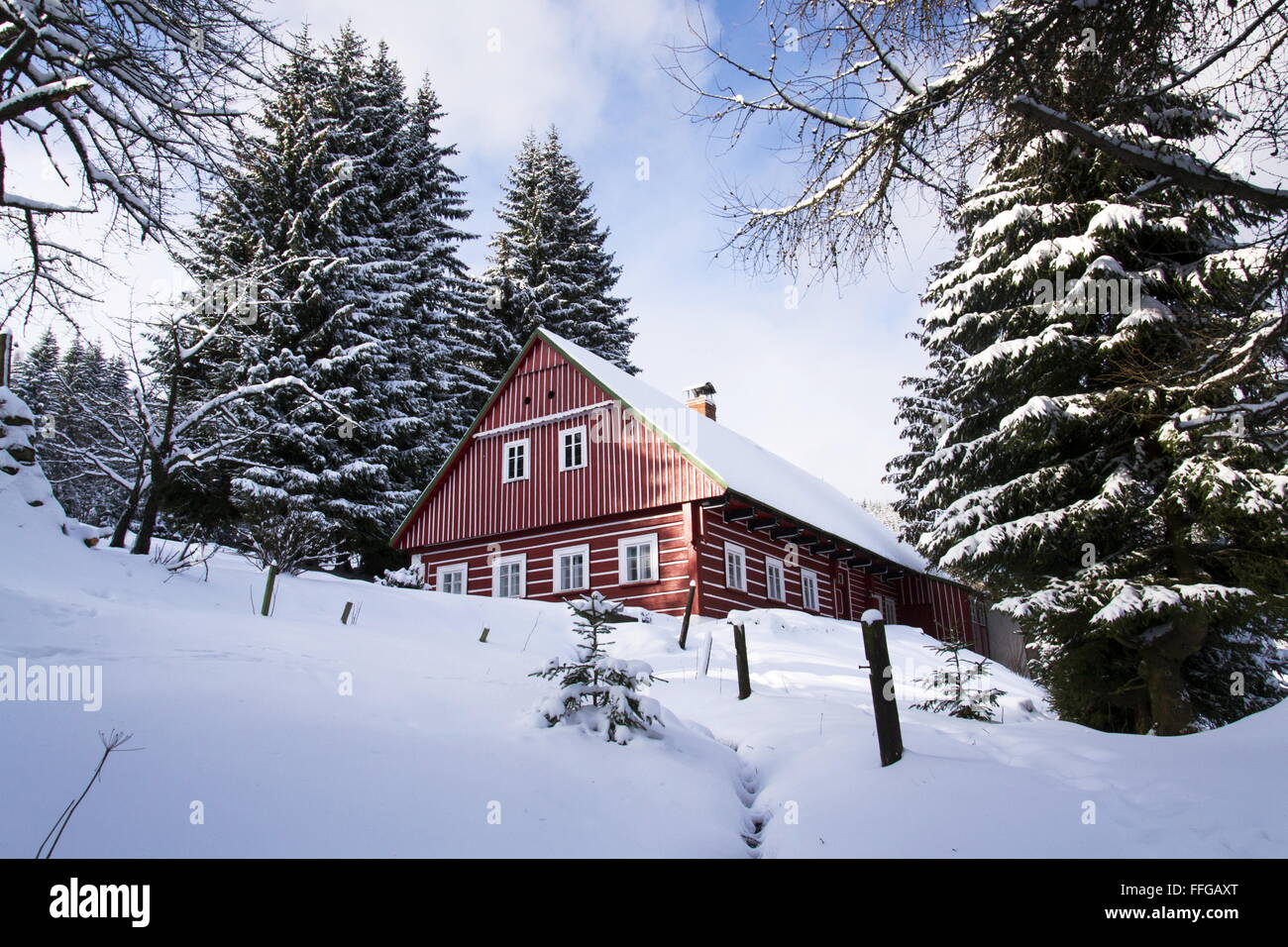 Red wooden cabin in a frosty snowy country in sunny winter day Stock ...