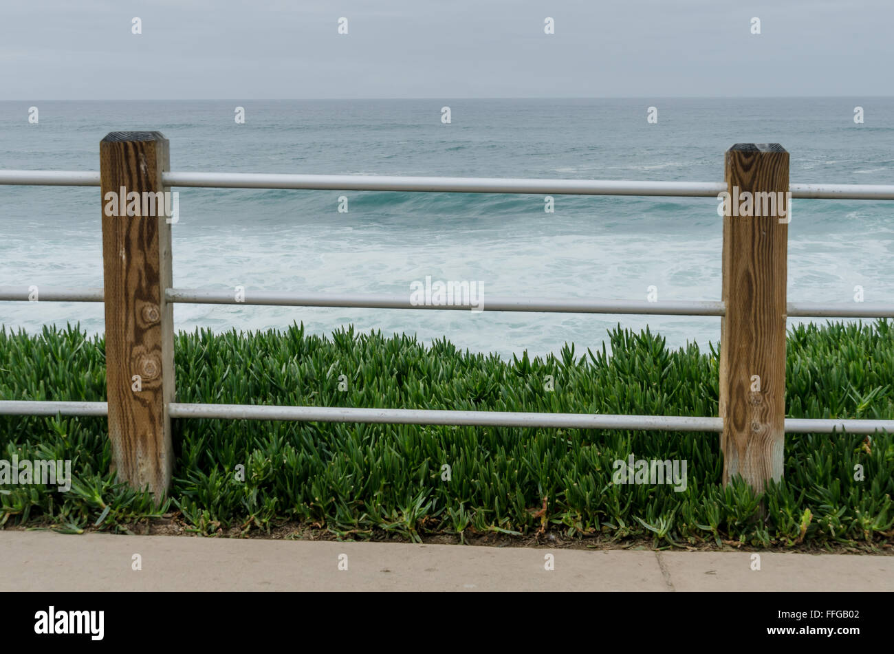Fence in front of the blue waters of the Pacific Ocean near La Jolla ...