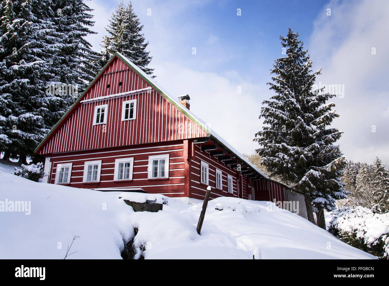 Red wooden cabin in a frosty snowy country in sunny winter day Stock ...