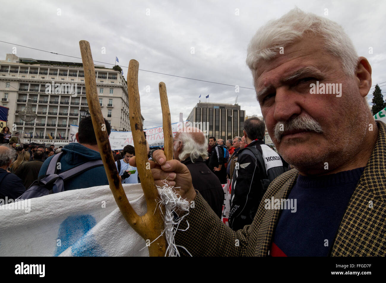 Athens, Greece. 13th Feb, 2016. A farmer with his rake is seen during ...