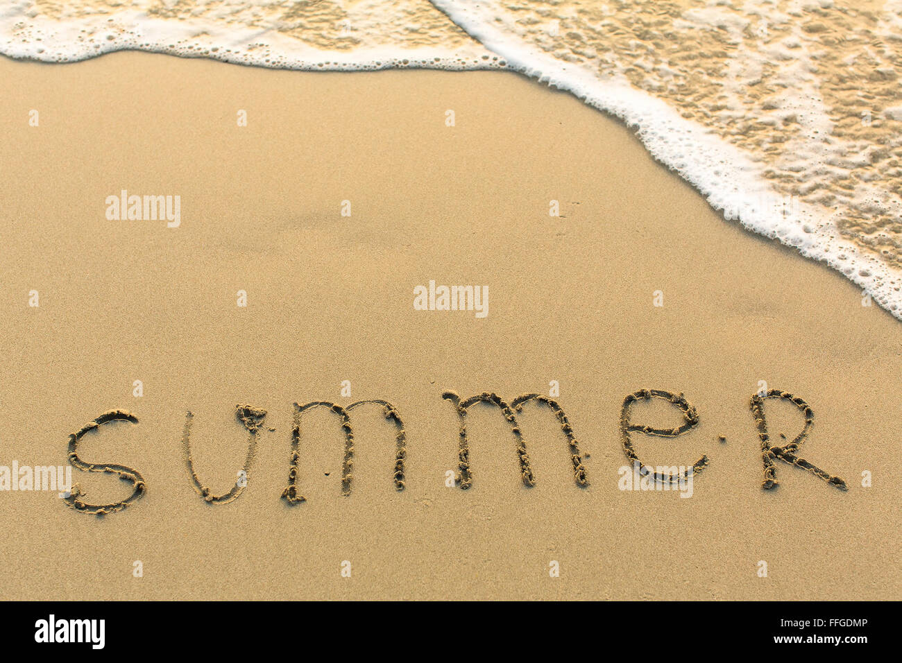 Summer - word drawn on the sand beach with the soft wave Stock Photo ...