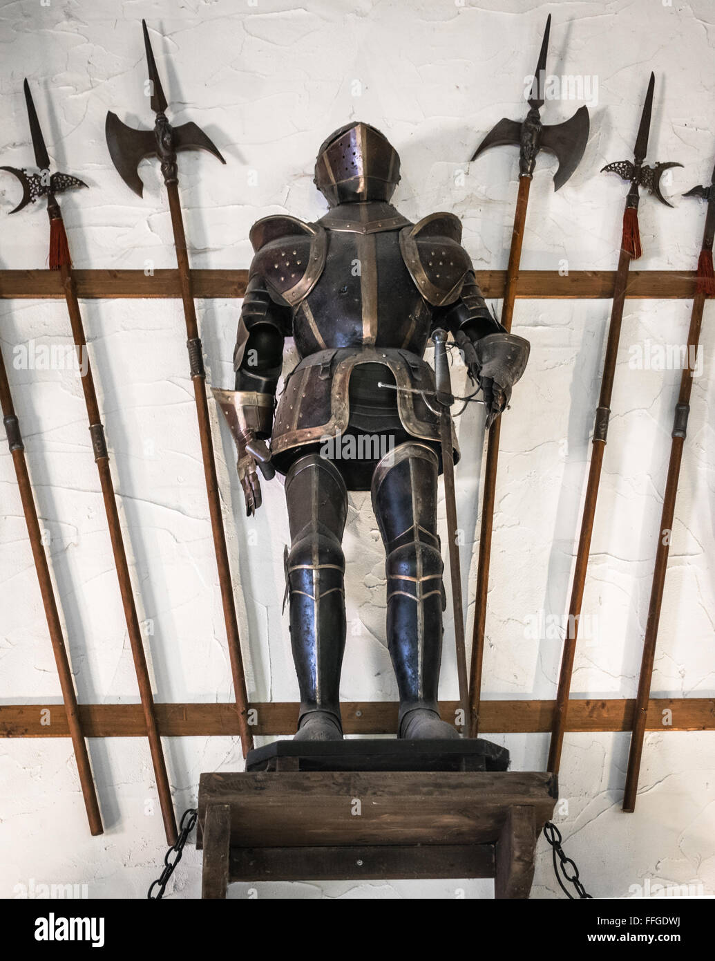 Medieval armor exposed along with metal halberds Stock Photo - Alamy