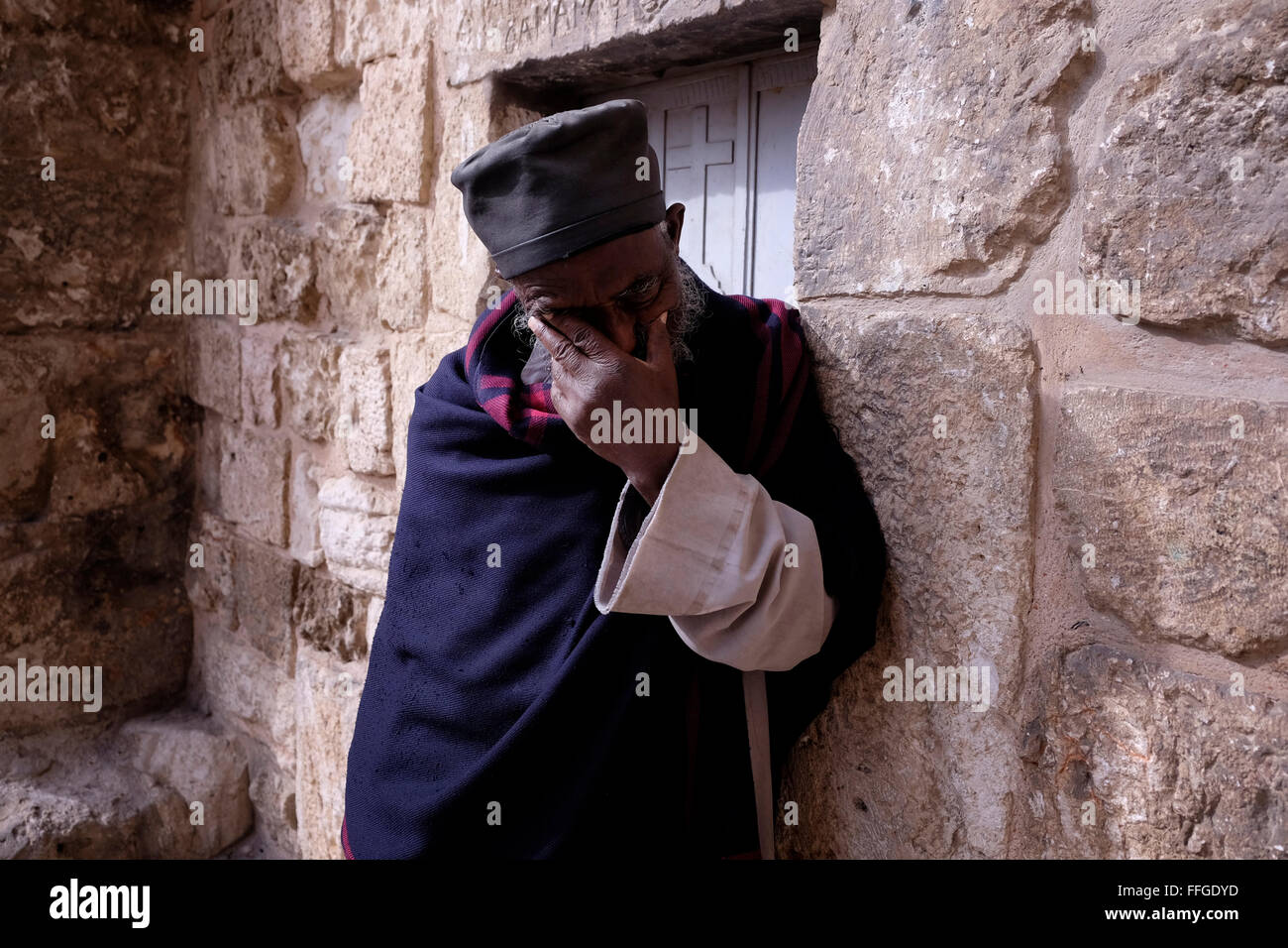 Ethiopian orthodox monk at entrance to the Ethiopian orthodox chamber ...