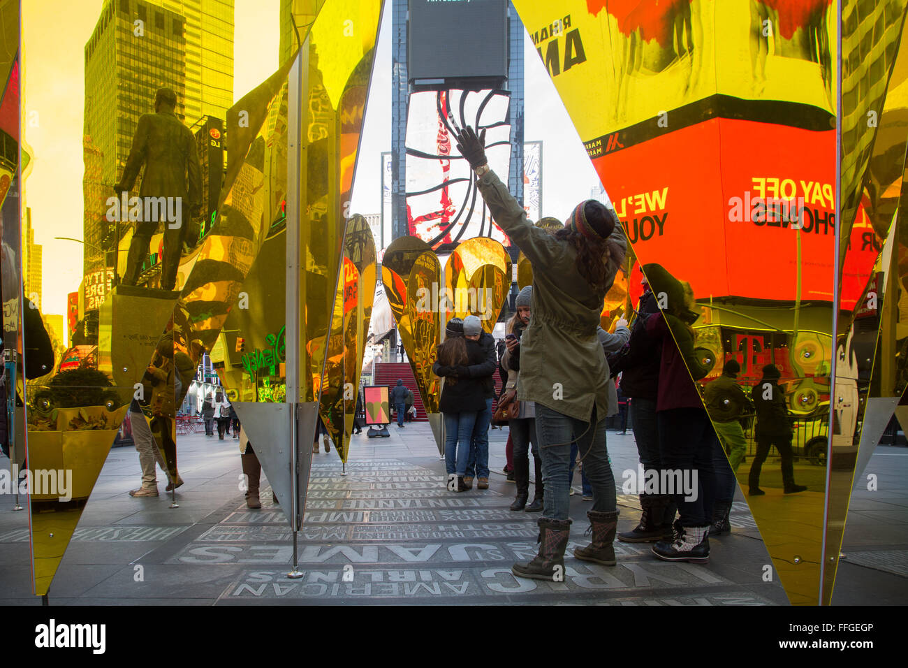New York, United States. 13th Feb, 2016. A couple hug in Times Square ...