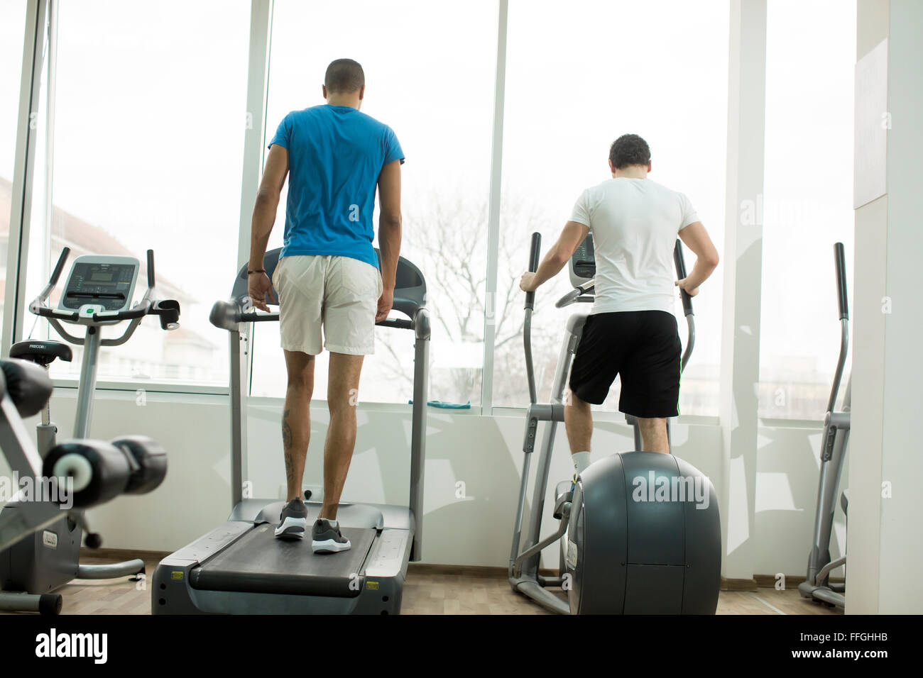 Young multiracial men in the gym Stock Photo - Alamy