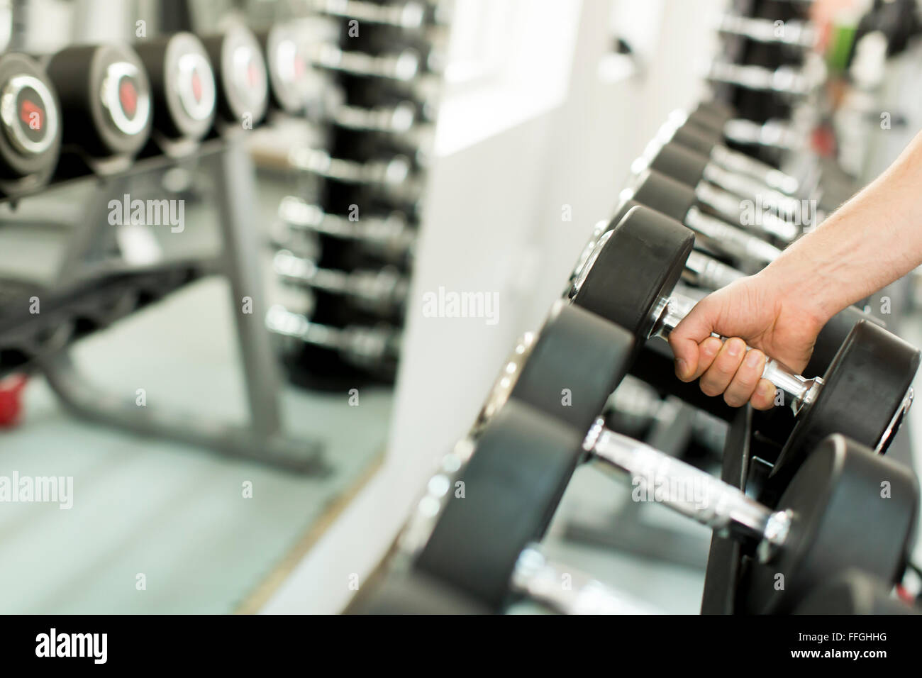 Dumbbell in the gym Stock Photo - Alamy