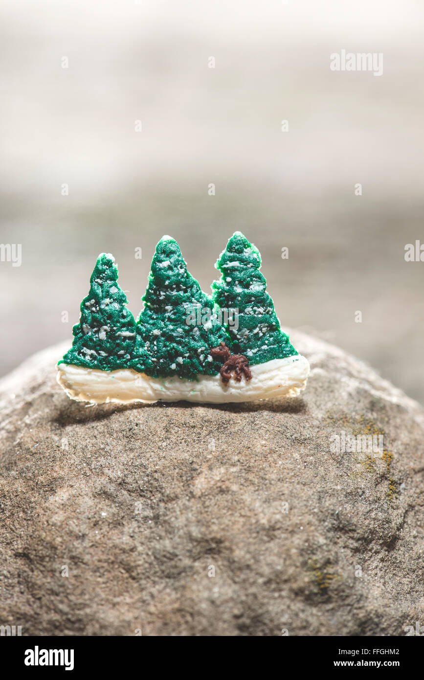 Miniature figures of pine trees during the winter Stock Photo - Alamy
