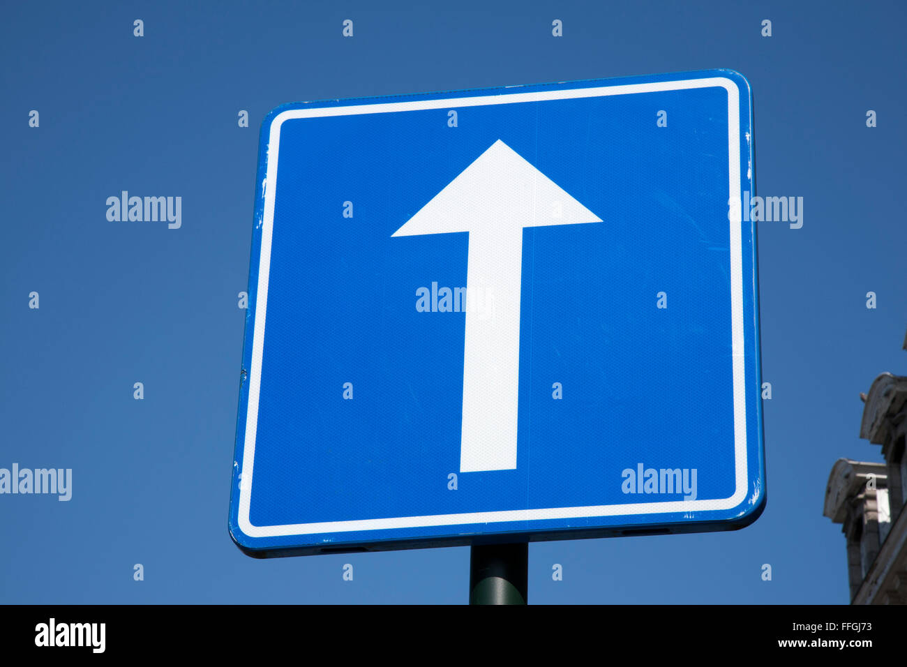 Blue and White Arrow Sign on Sky Background Stock Photo - Alamy
