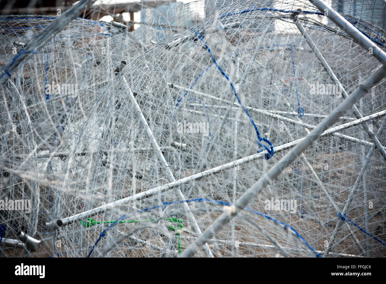 Metal fishing nets in a port. Horizontal shot Stock Photo - Alamy