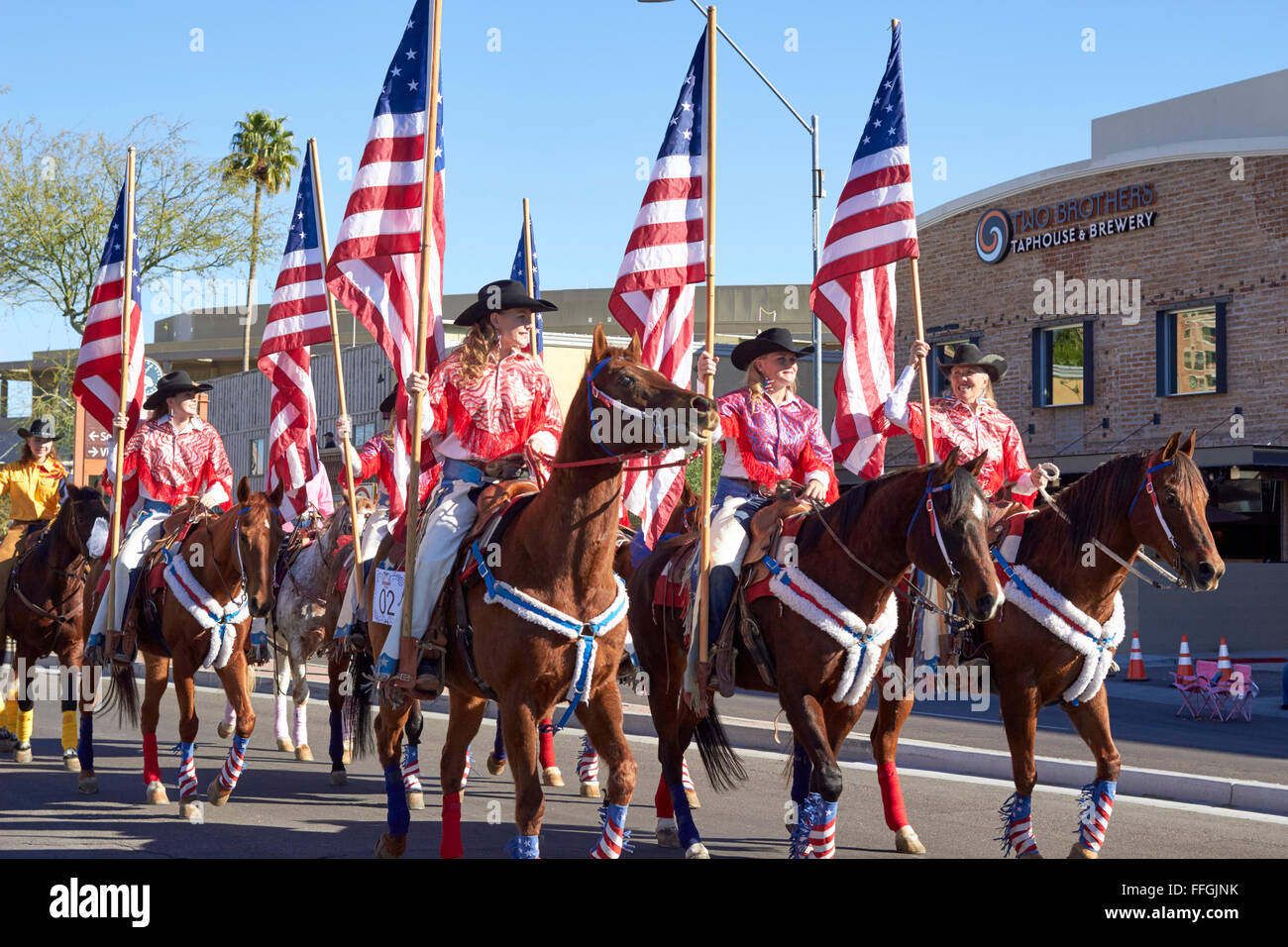 Scottsdale, Arizona, USA. 13th February, 2016. Horse riders carry ...