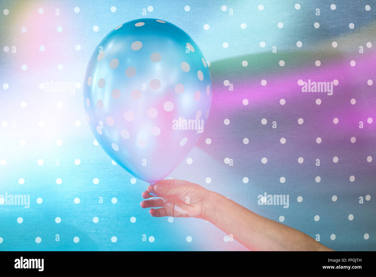 Balloon with white points on blue background Stock Photo - Alamy
