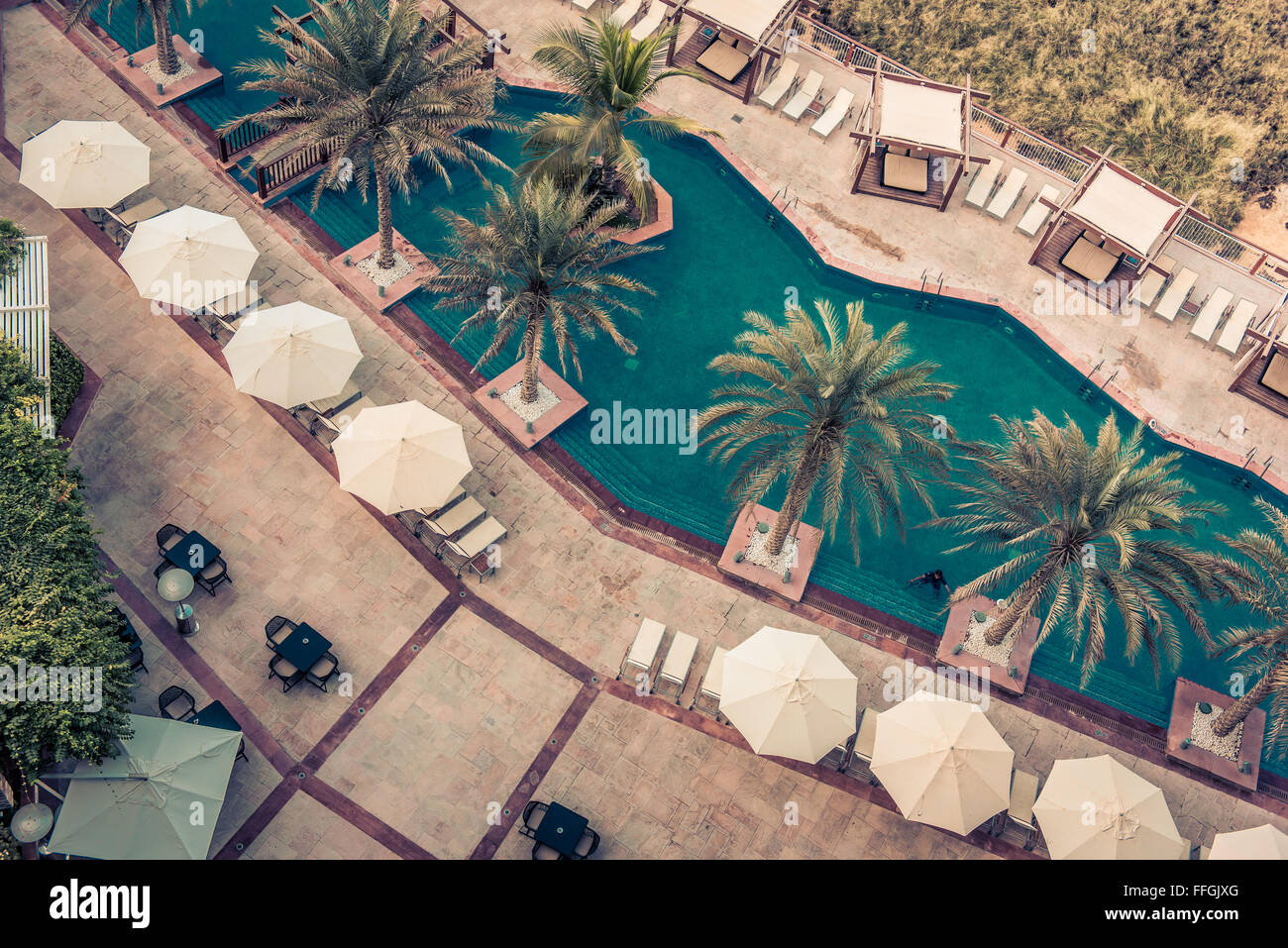 Hotel Poolside with Parasols and Palms. Top view shot Stock Photo - Alamy