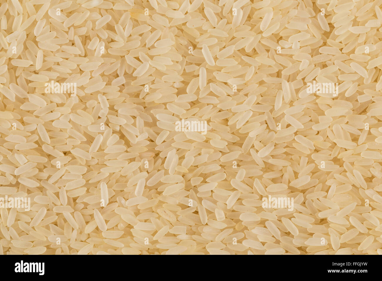 Uncooked rice background close up shot image Stock Photo - Alamy